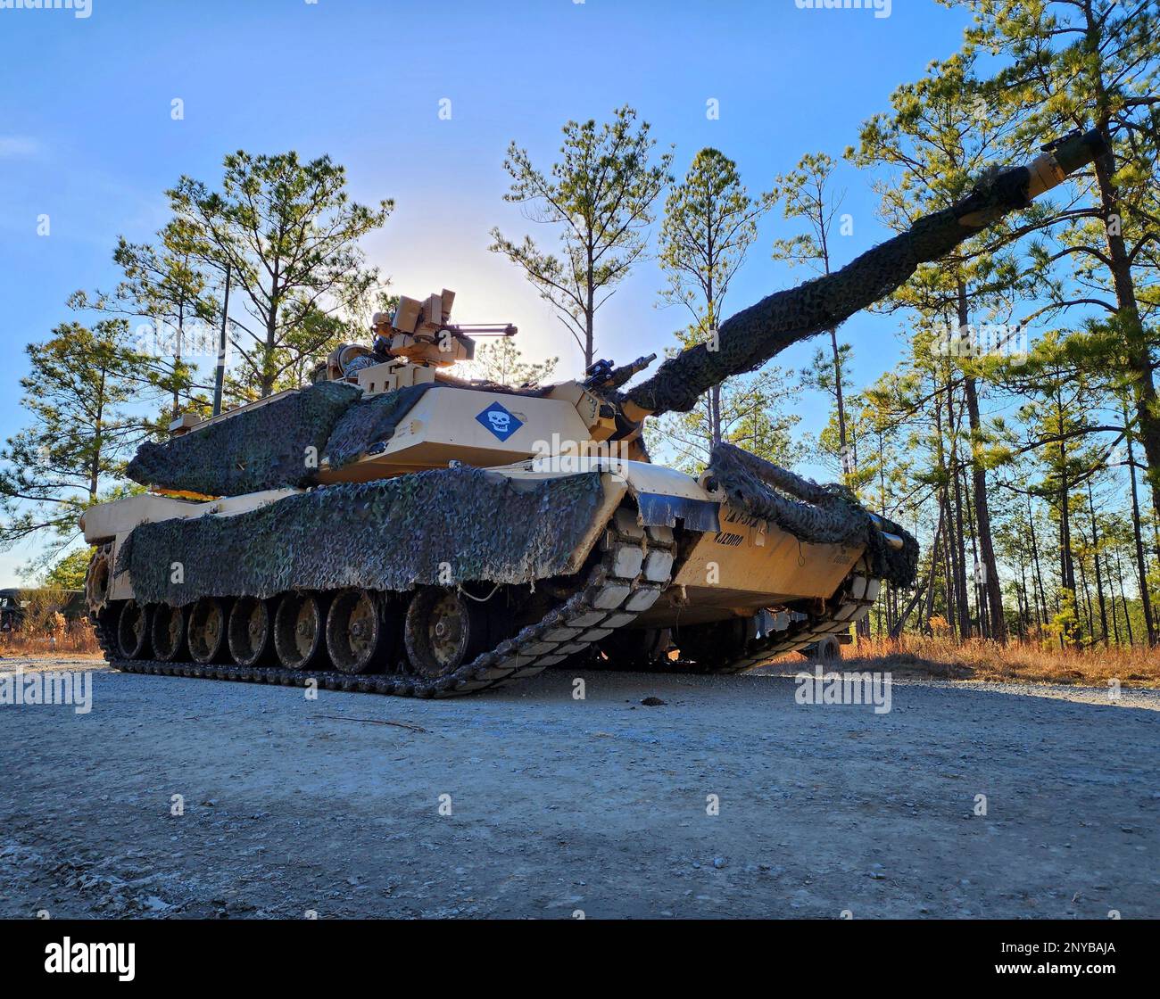 An M1 Abrams tank maneuvers through a town in the box at the Joint ...