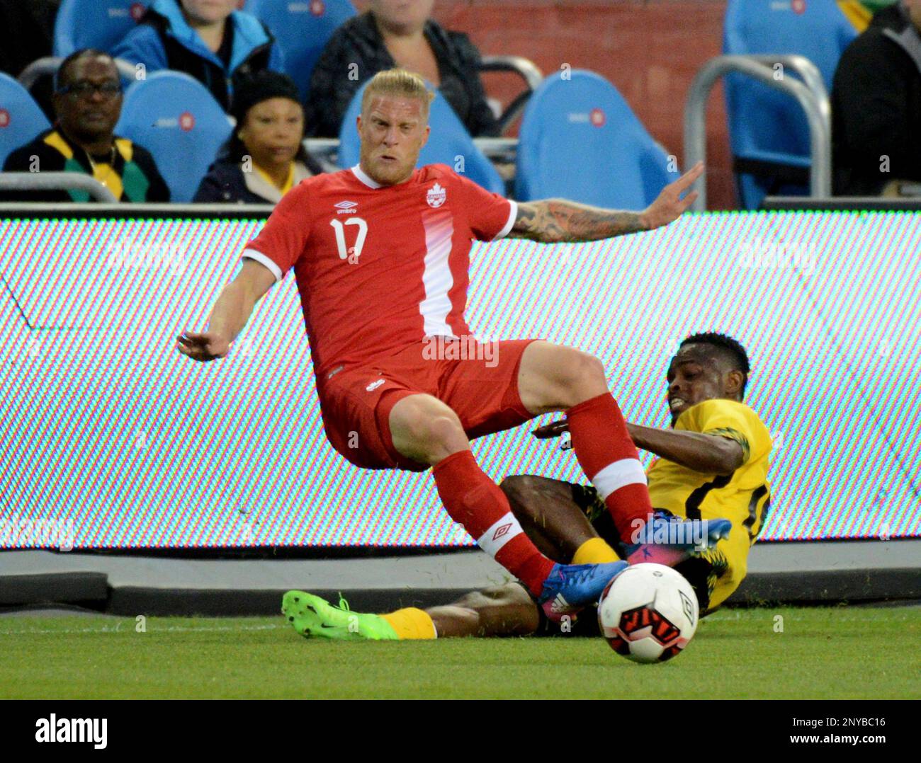 Canada's Marcel De Jong, left, and Jamaica's Dane Kelly compete for the ...