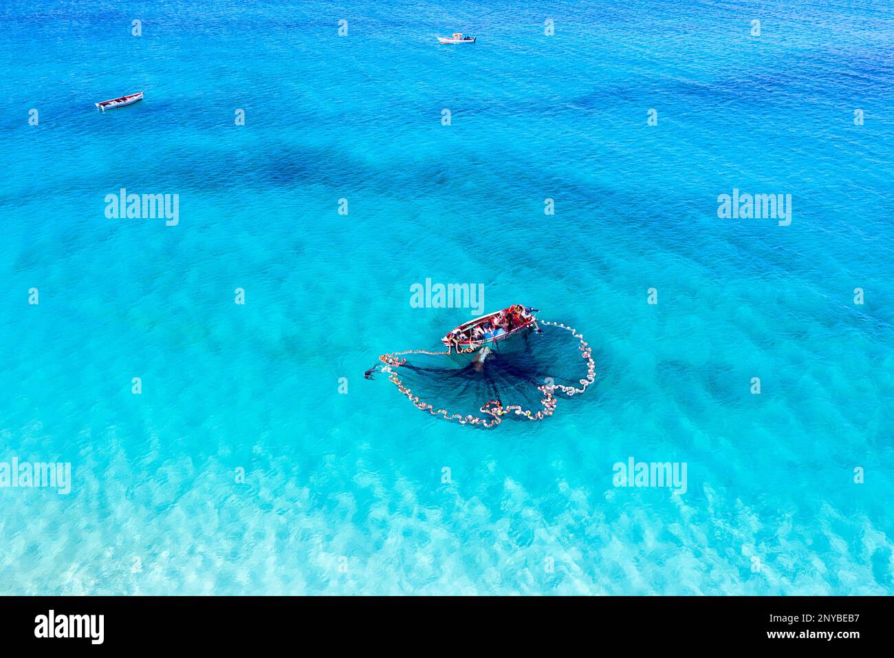 Aerial view of Local fishermen fishing with fishing net from a boat in ...