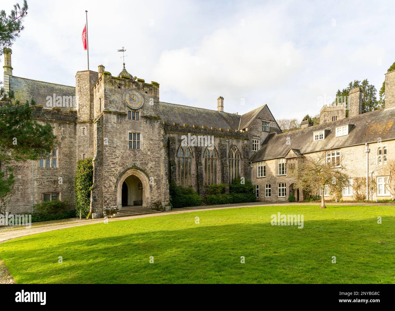 Historic medieval buildings in courtyard of Great Hall, Dartington Hall ...
