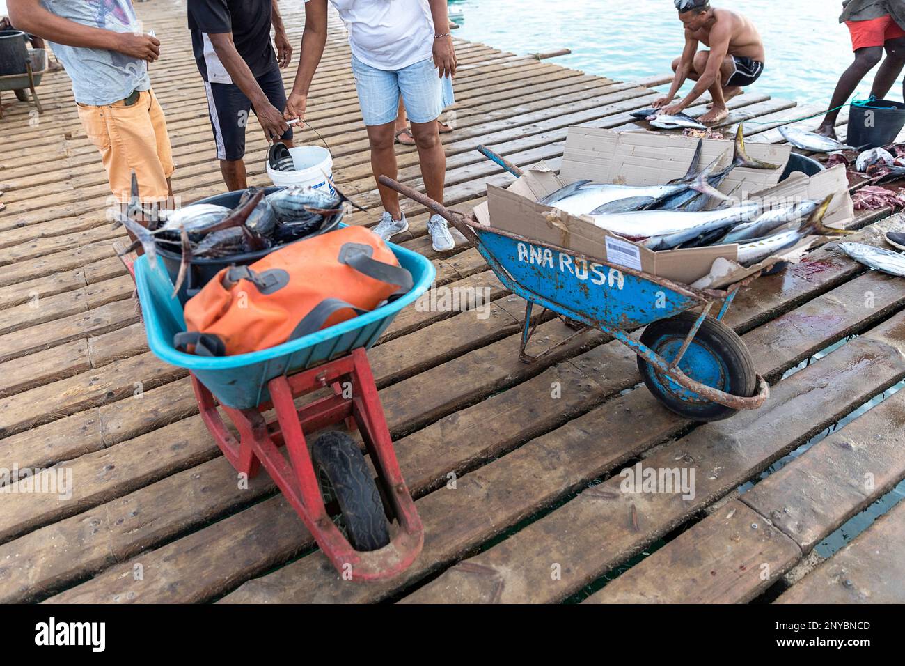 Famous wooden pier in Santa Maria town on Sal island, full of fishermen ...