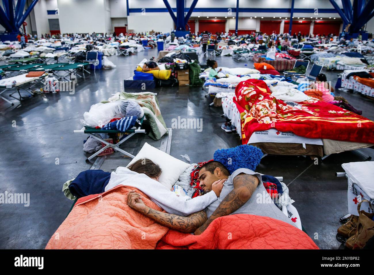 Tammy Dominguez, left, and her husband, Christopher Dominguez, sleep on ...