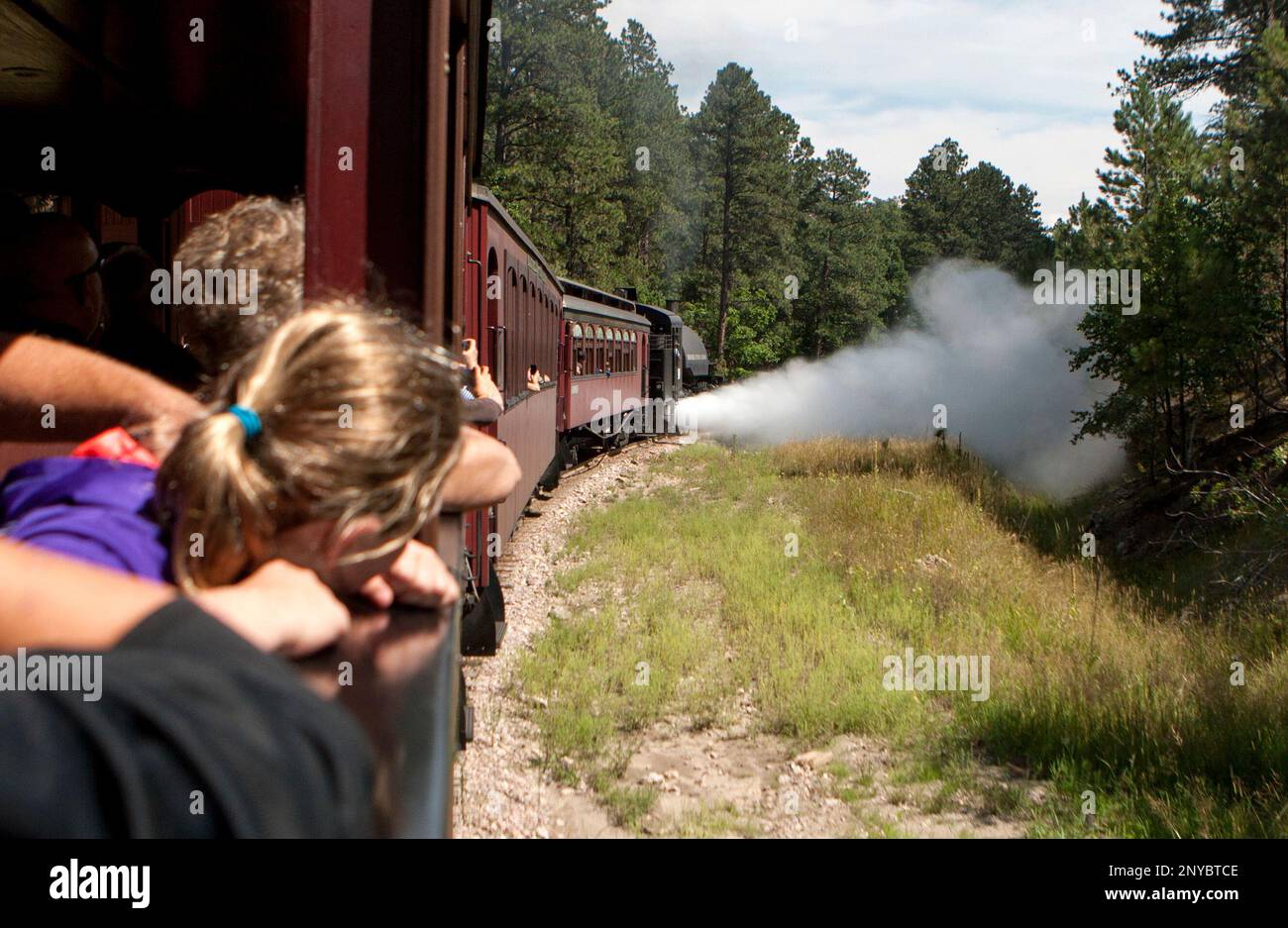 In this Aug. 16, 2017, photo, passengers watch as the 1880 Train vents ...