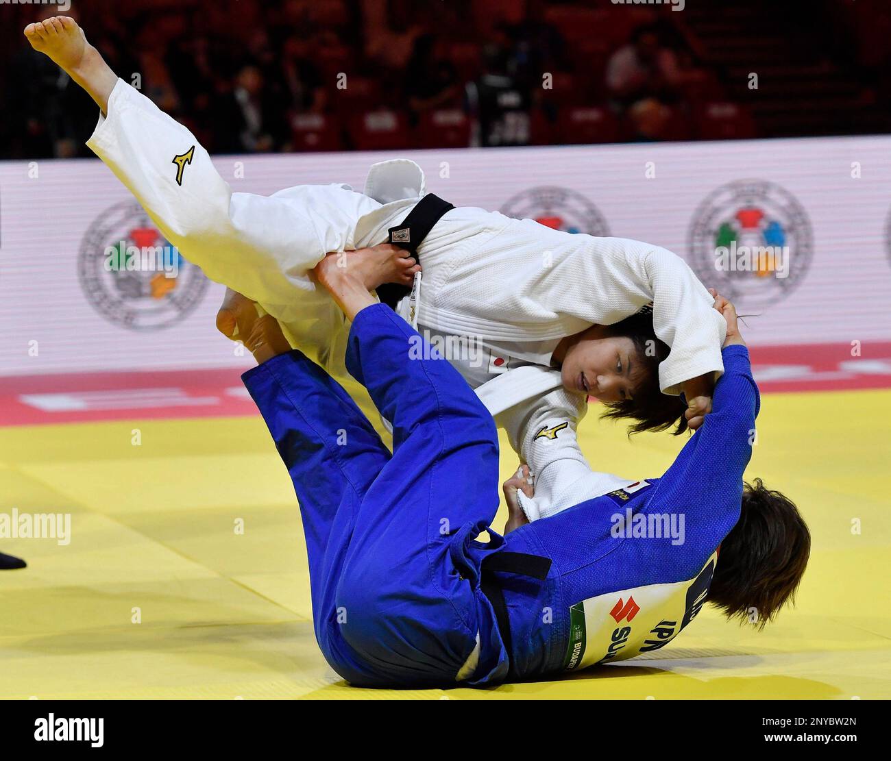 Ai Shishime of Japan, background and her compatriot, Natsumi Tsunoda fight during the final ...