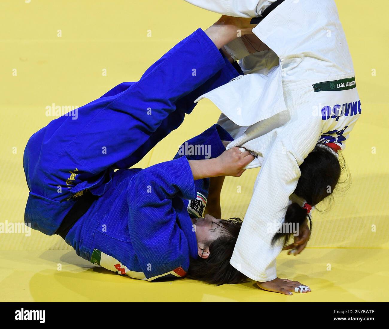 Natsumi Tsunoda, in blue, of Japan and Erika Miranda of Brazil fight in ...