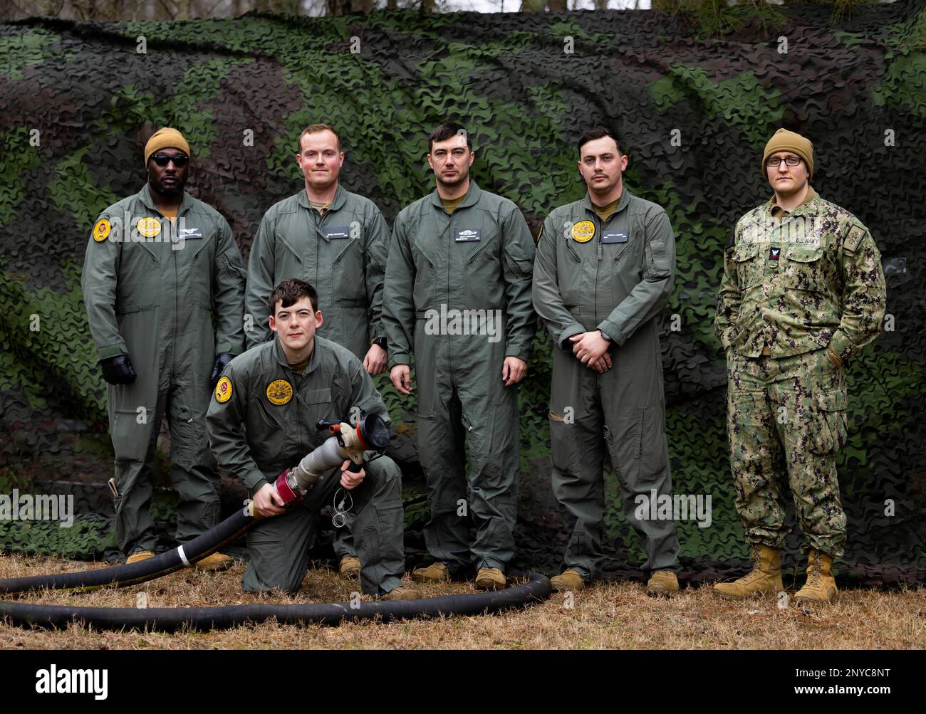 U.S. Sailors with Naval Cargo Handling Battalion One pose for a photo ...