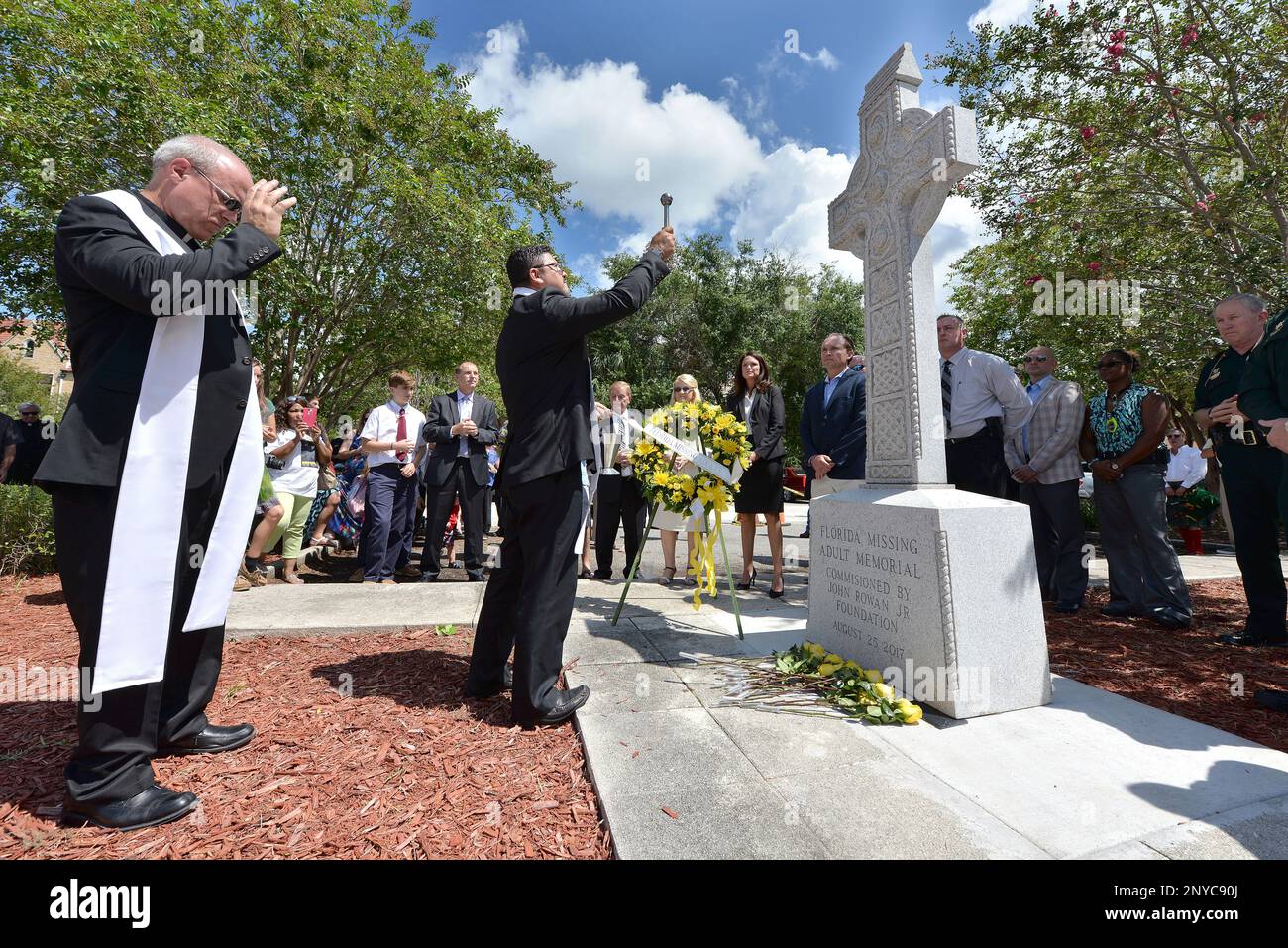 Father Ed Murphy, from left, former rector and Father John Guarnizo, pastor of Blessed Trinity ...