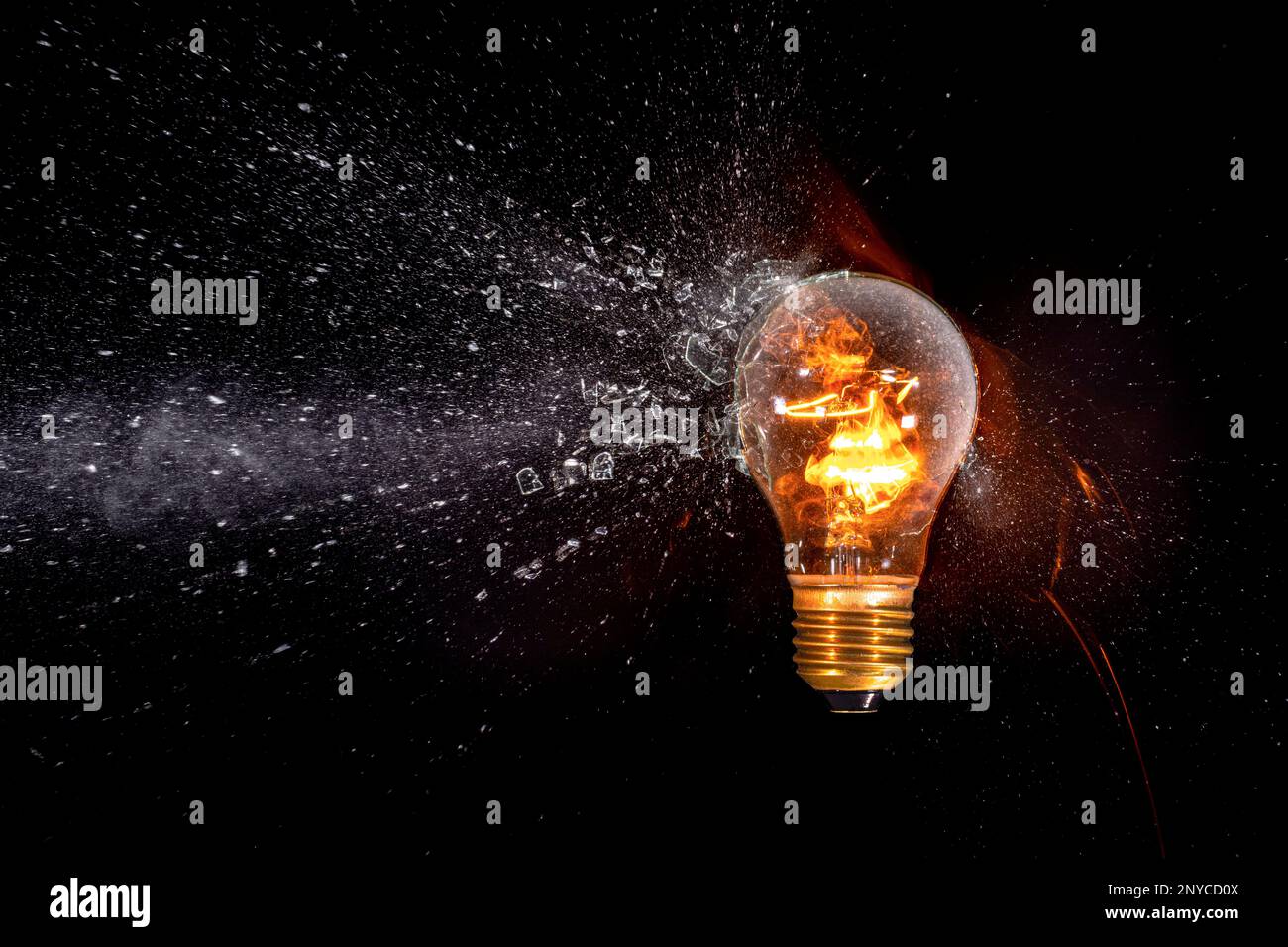 lit bulb hit by projectile explosion and fragments Stock Photo - Alamy