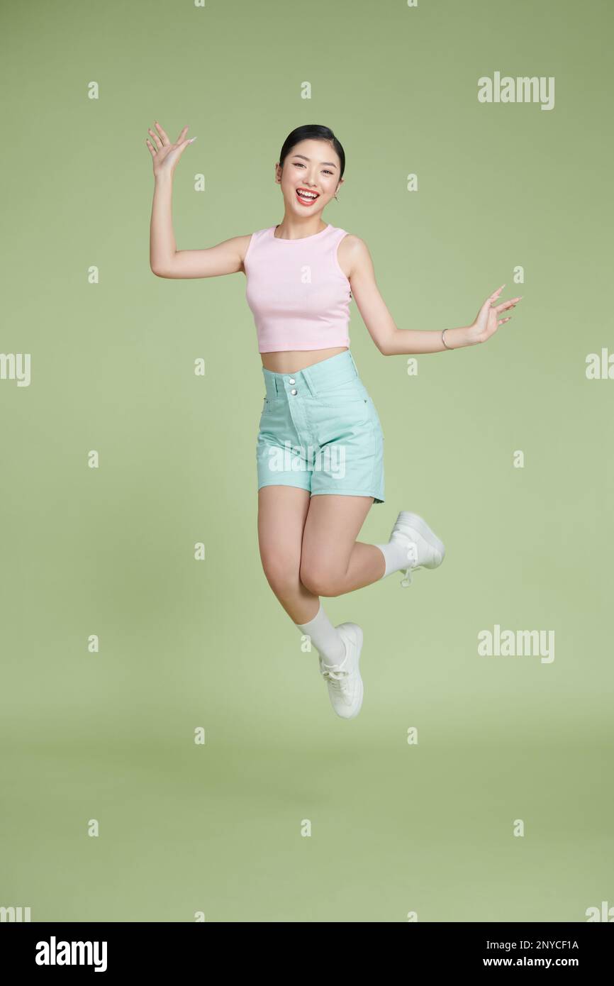 Full length body size photo woman surprised amazed jumping up happy ...