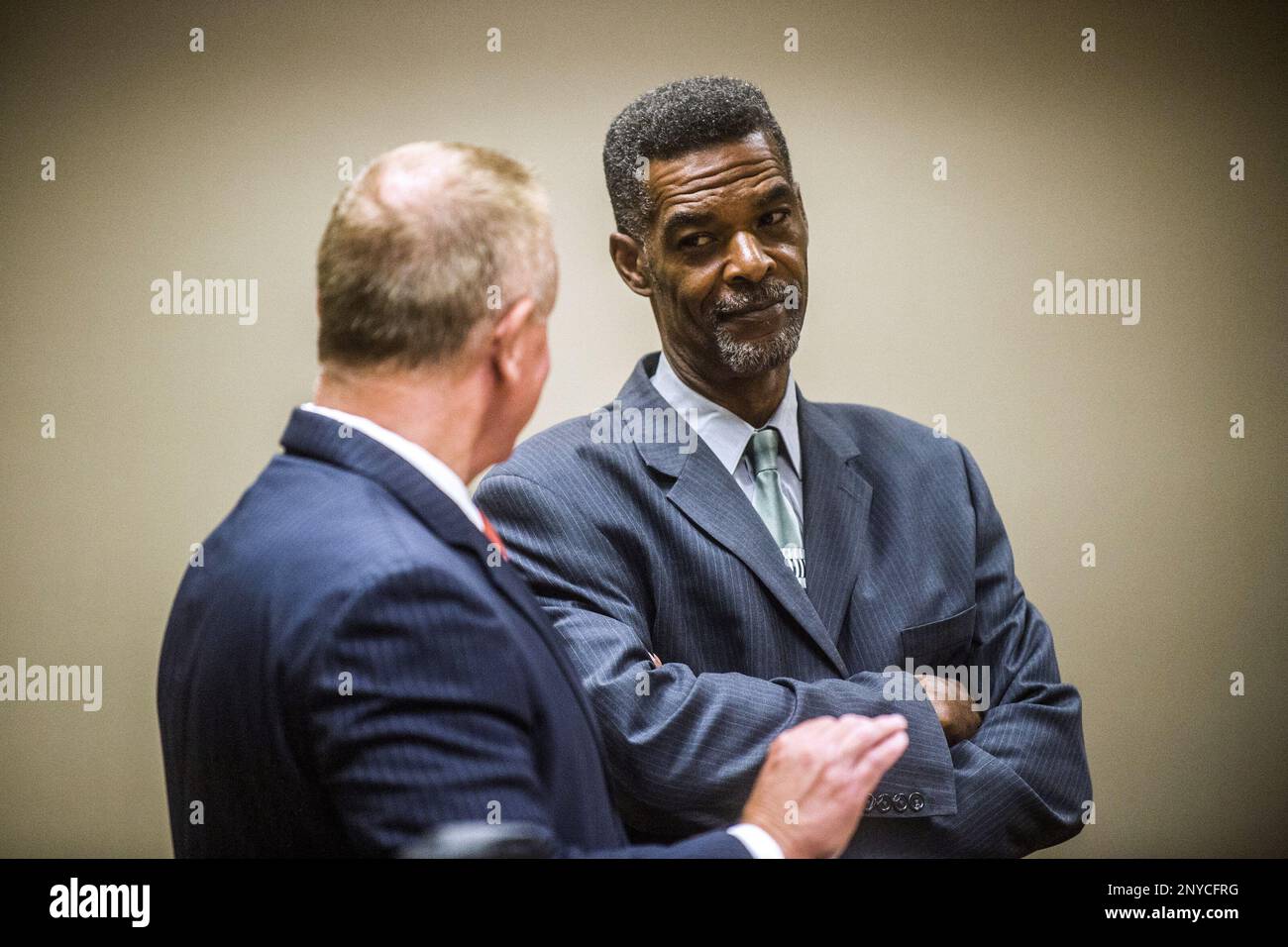 Flint City Councilman Eric Mays, right, speaks with his defense ...