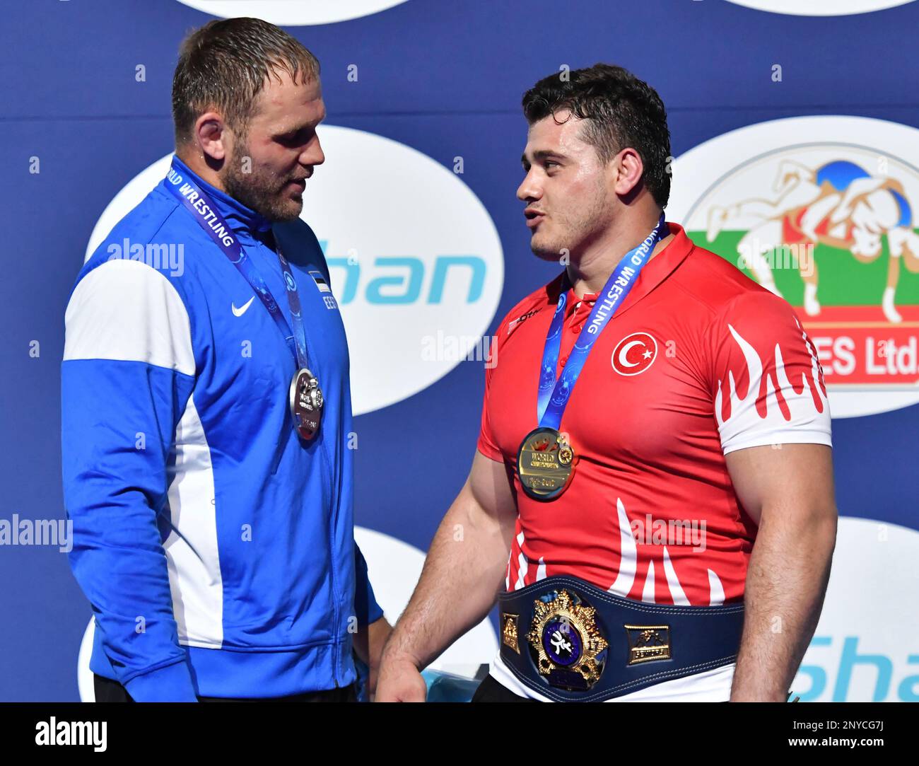 Riza Kayaalp (R) of Turkey, placed 1st, and Heiki Nabi of Estonias, 2nd ...