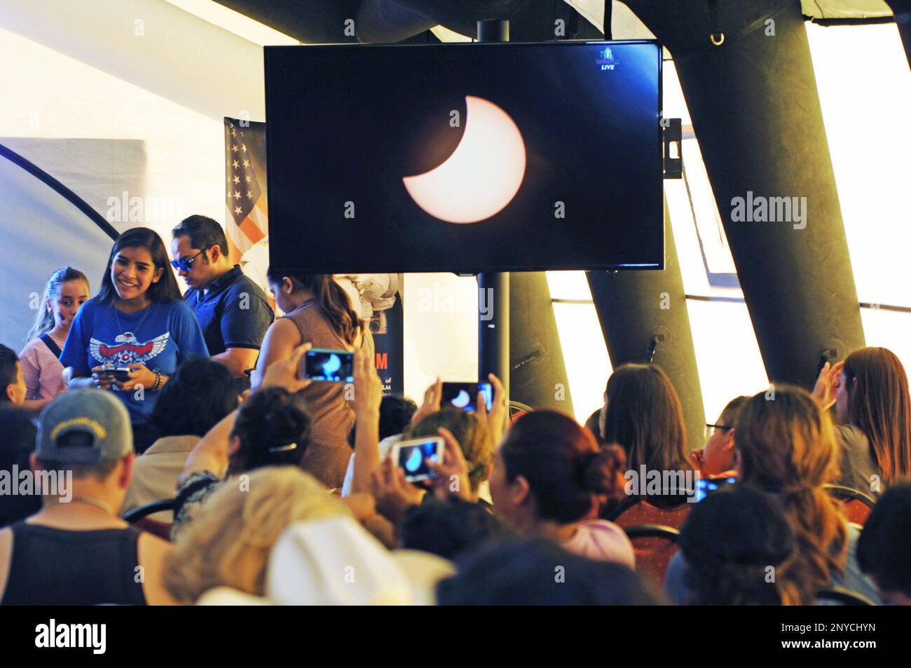 Brownsville residents take photos with their cell phones Monday, August ...