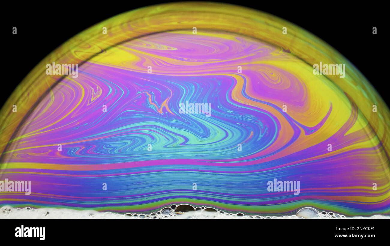bubble soap lit below reveals a multitude of color nuances Stock Photo ...