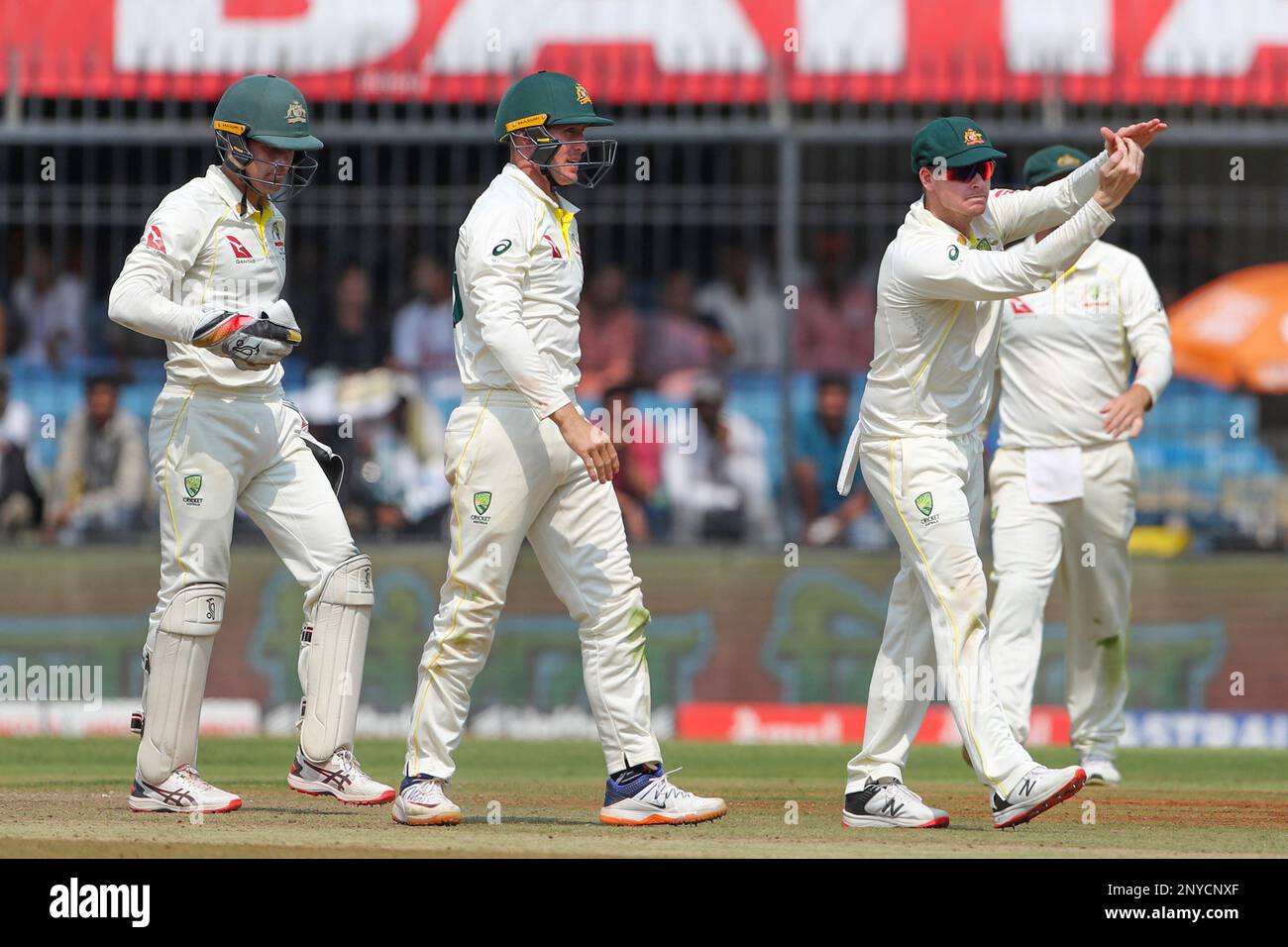 Australia's captain Steve Smith, second right, signals for a third ...