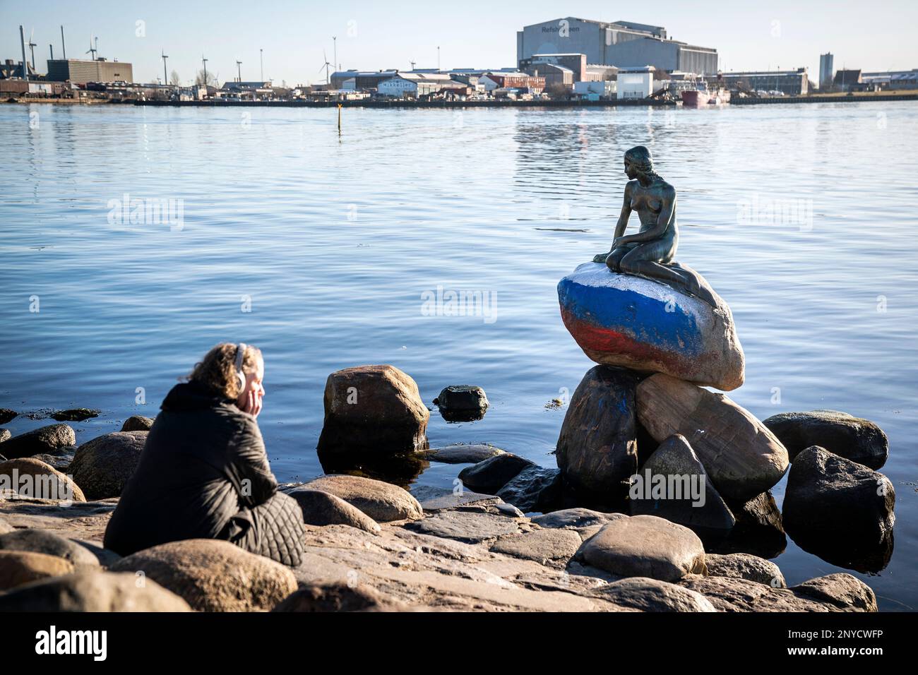 The Russian flag is painted on the stone where the Little Mermaid sits ...