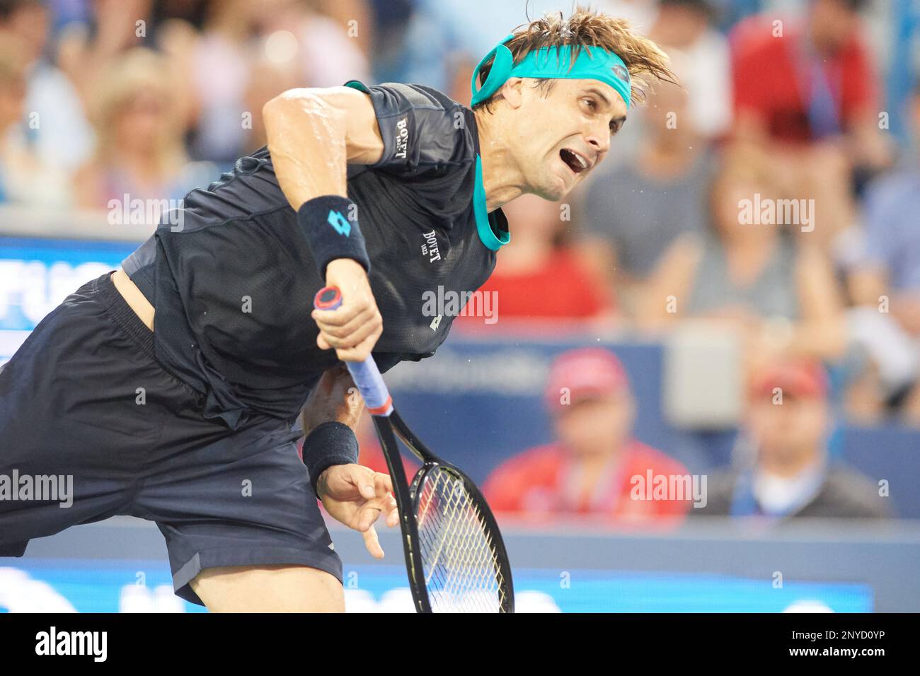 CINCINNATI, OH - AUGUST 19: David Ferrer of Spain serves to Nick ...