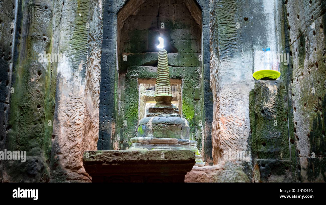 A Buddhist stupa in a stone passageway running through the renovated ...