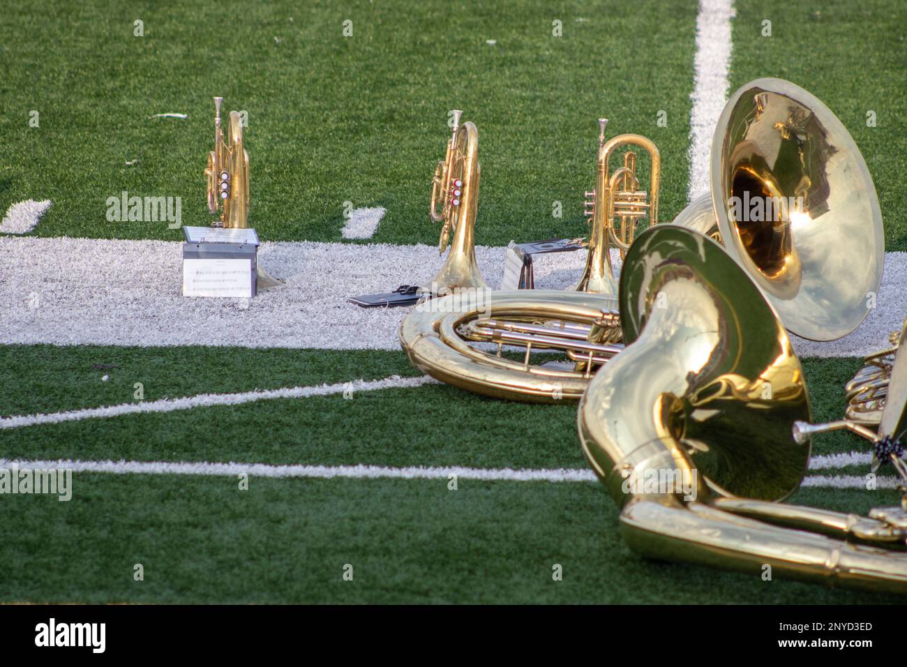 High School Band Instruments set on football field ready to play . High ...