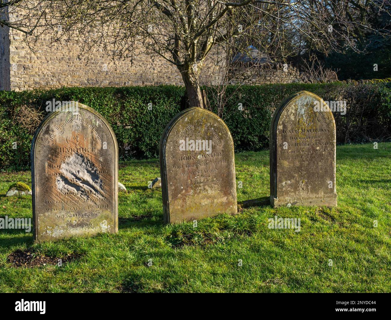 Three old weathered gravestones in the churchyard of St Mary, Cold ...