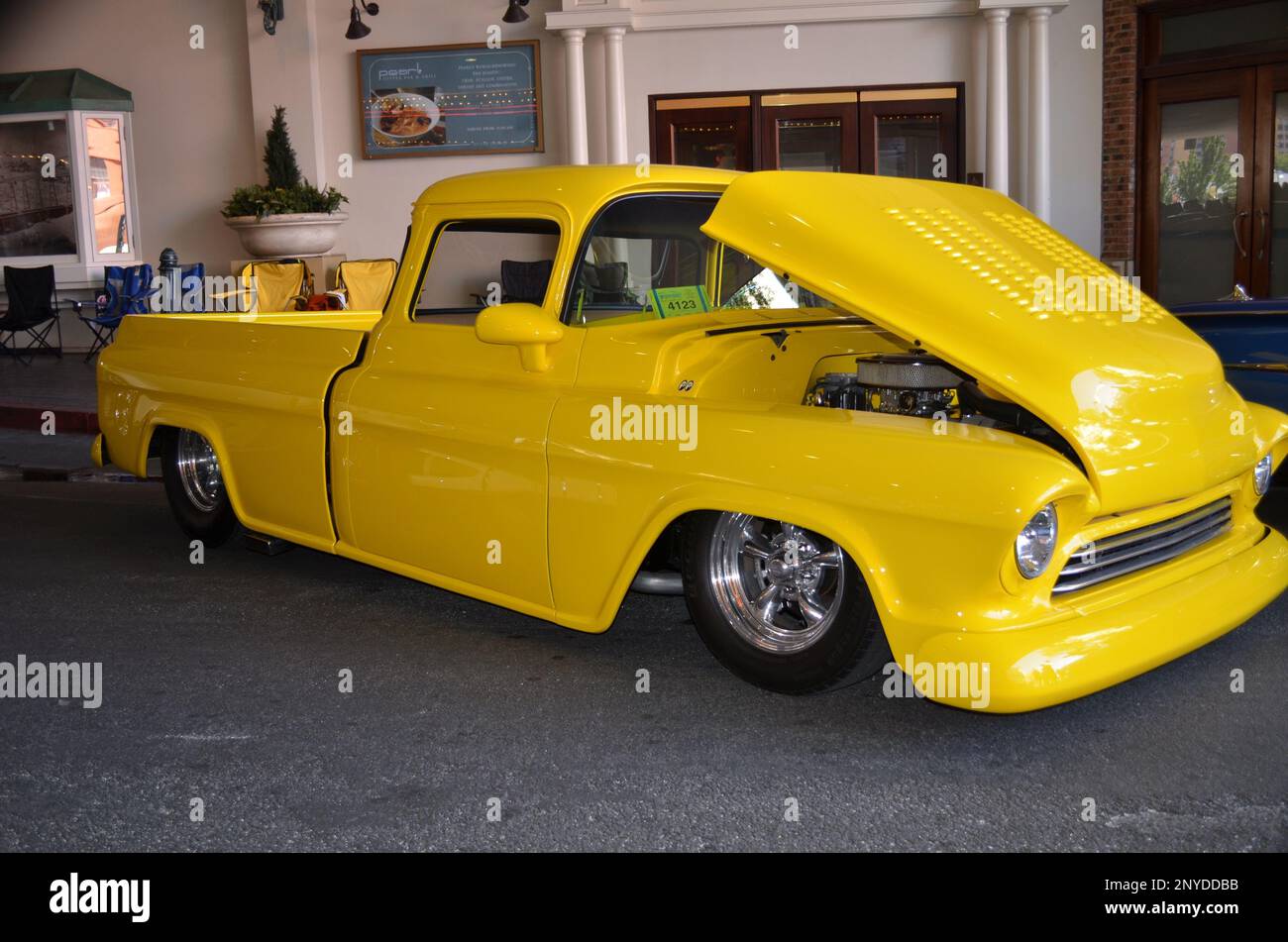 RENO, NV - AUGUST 10: 1955 Chevy Pickup with bright yellow exterior ...
