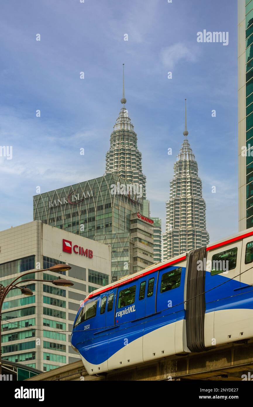 The Kuala Lumpur Monorail with the Petronas Twin Towers in the ...