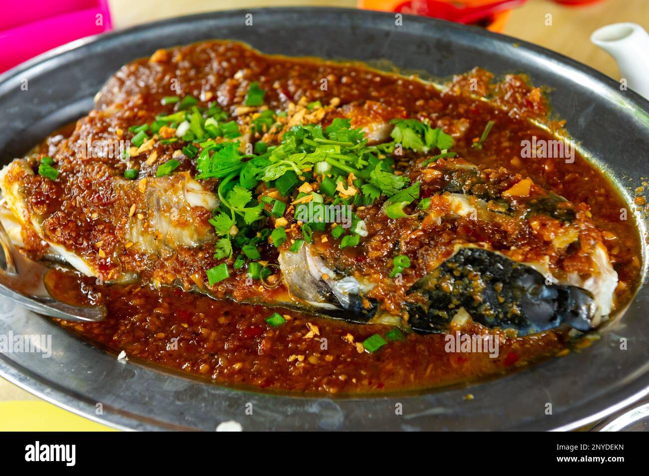 Steamed fish head in chilli sauce hi-res stock photography and images ...