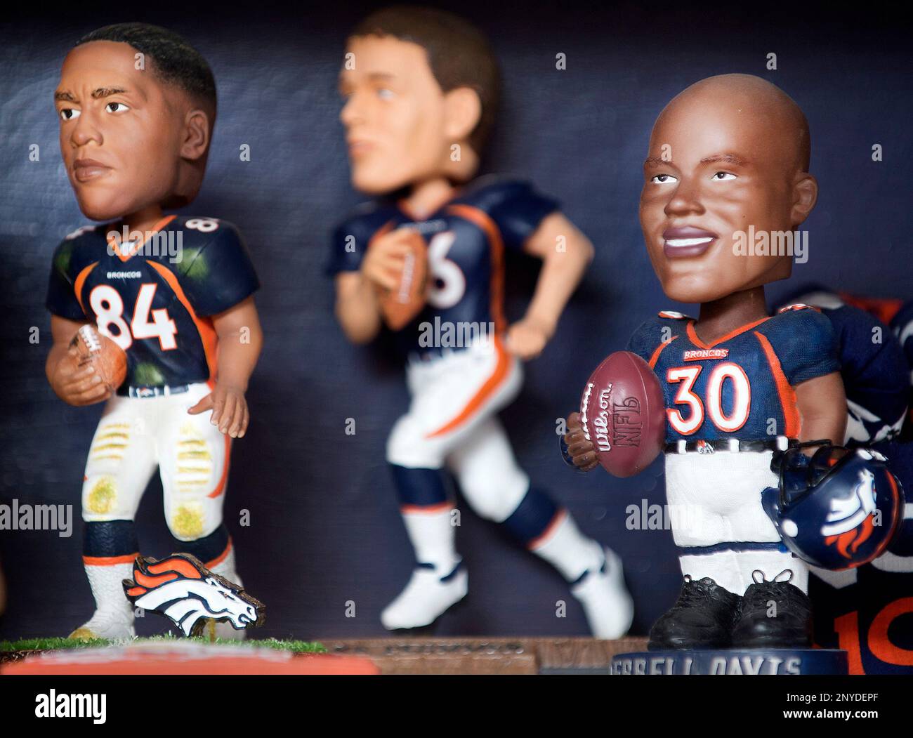 Bobbleheads of former Denver Bronco players, Shannon Sharpe, Bubby ...