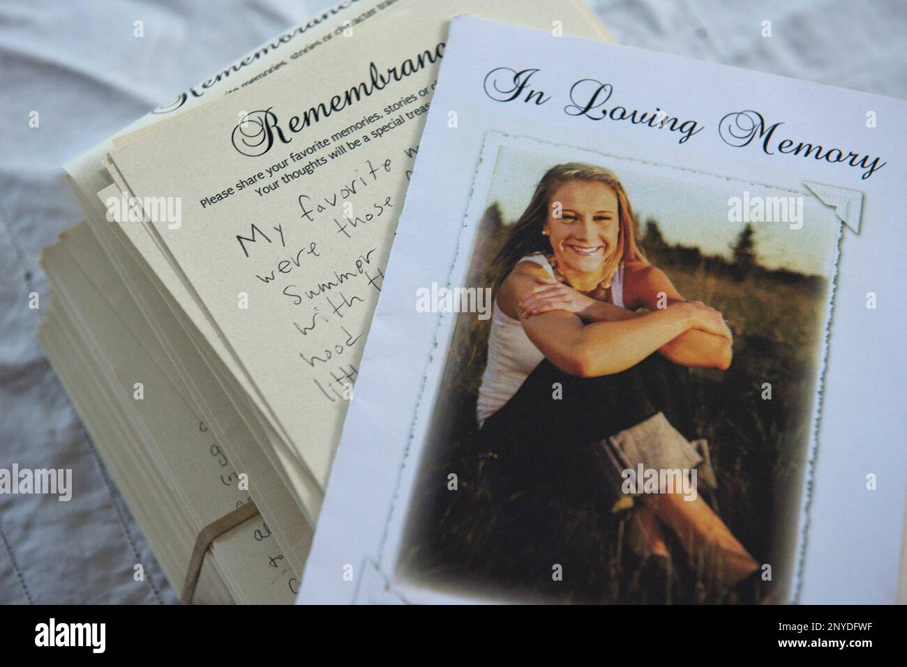 In this undated photo, Heidi Bucklin's memorial program sits on a stack ...