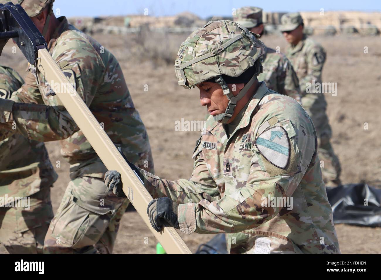 1st Cavalry Division Troopers comes together to breakdown the RCP tents ...