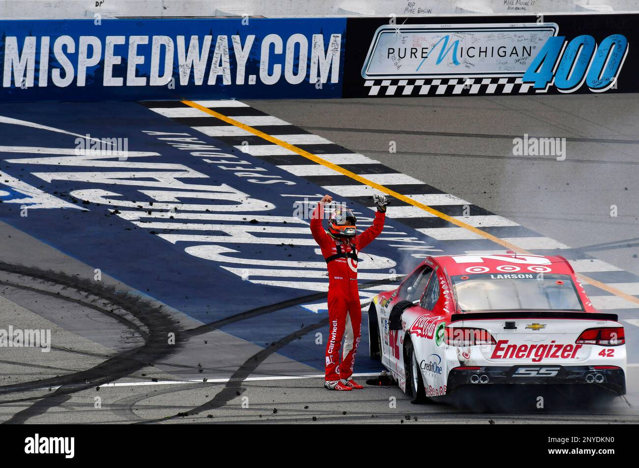 Kyle Larson (42) celebrates his win with a burnout during the NASCAR ...