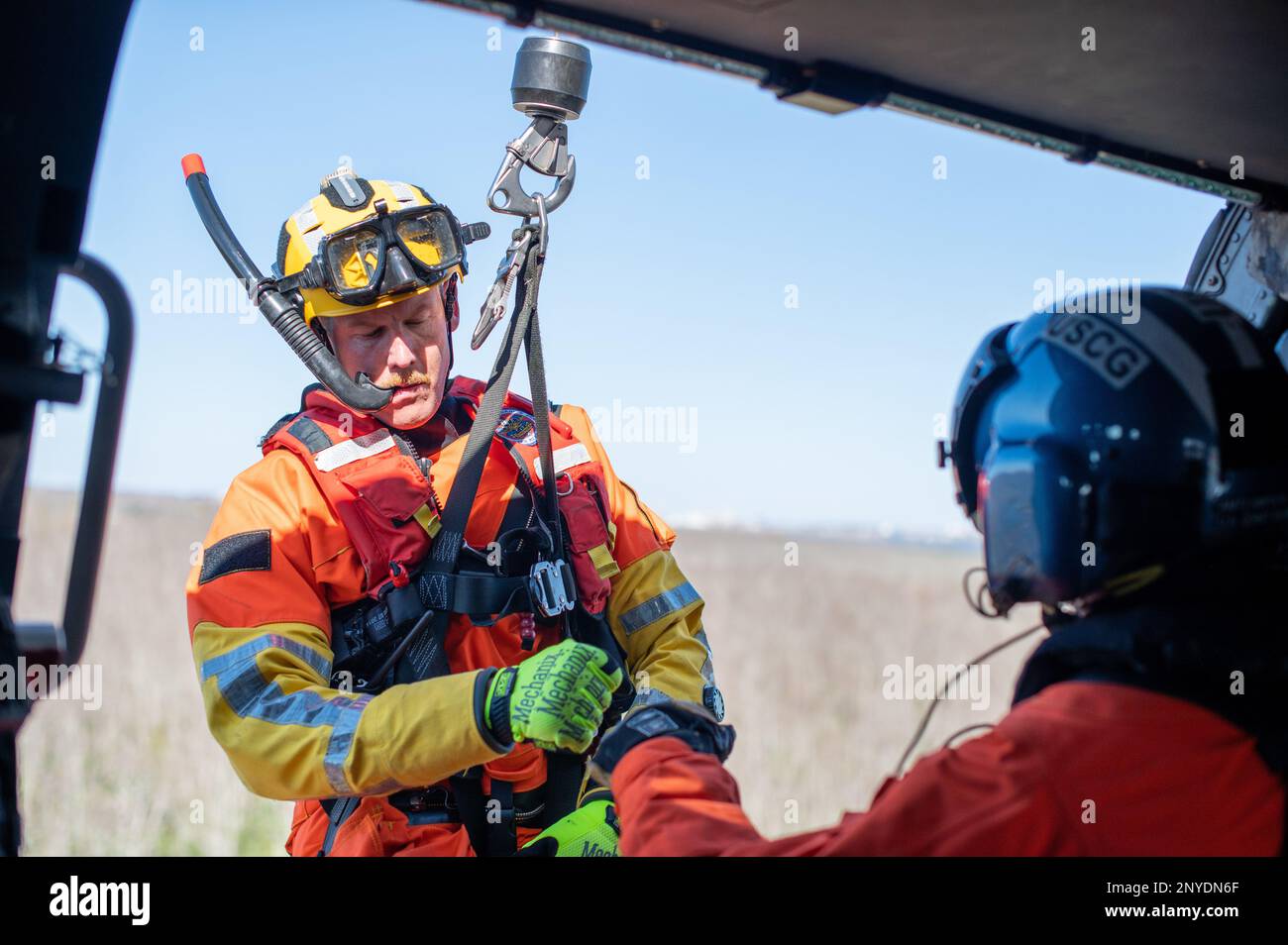 Petty Officer 2nd Class Richard Hoefle, a rescue swimmer assigned to ...