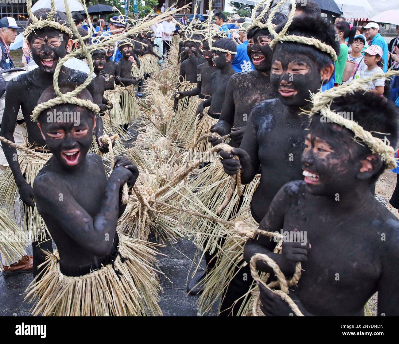 Children, clad in head-to-toe in soot parade the streets drawing a ...