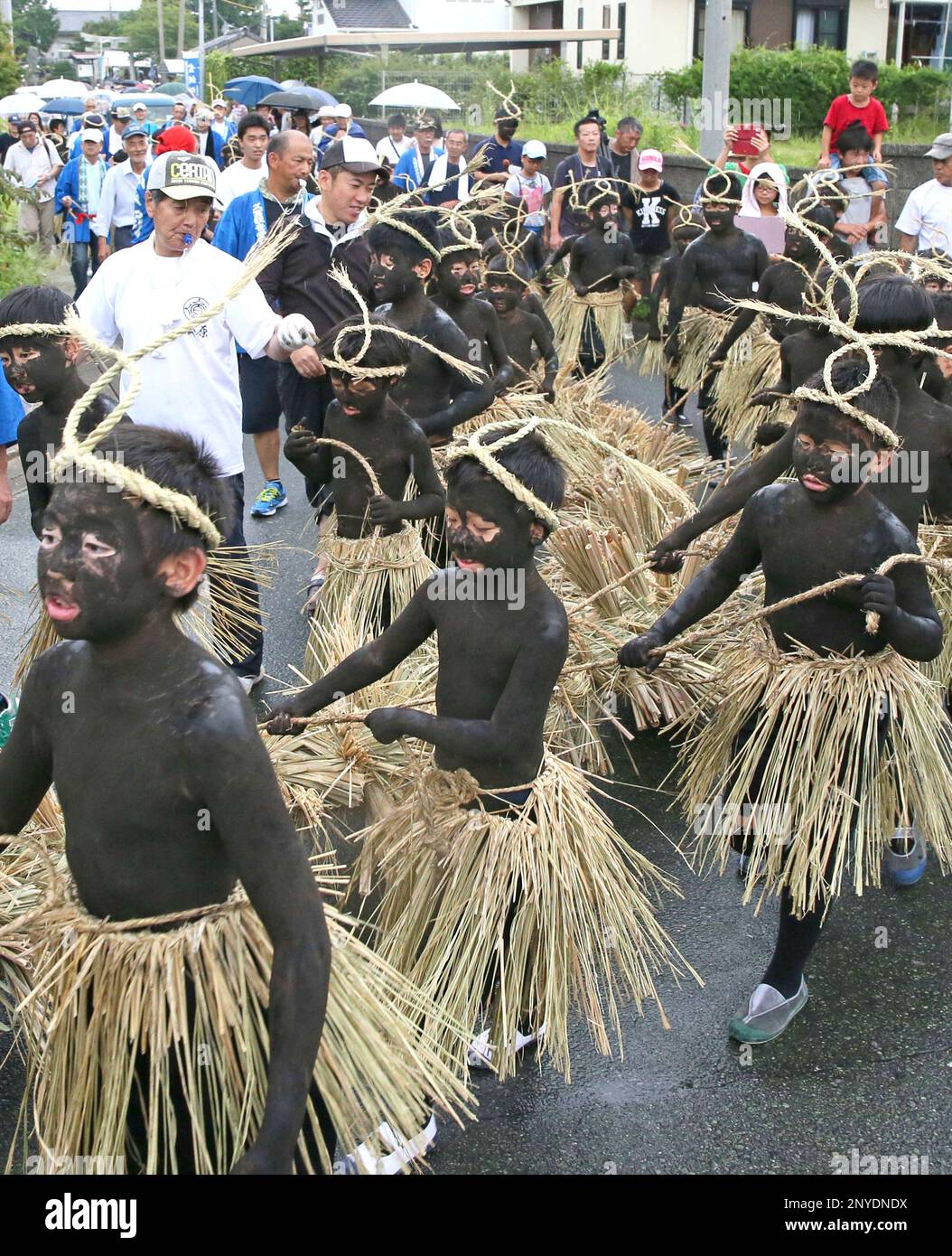 Children, clad in head-to-toe in soot parade the streets drawing a ...