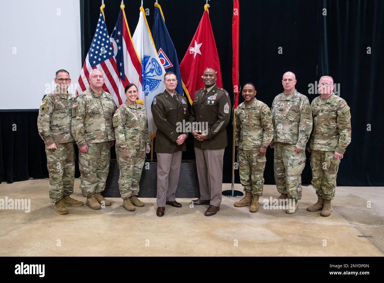Brig. Gen. Thomas E. Moore, center left, stands for a photo with the ...