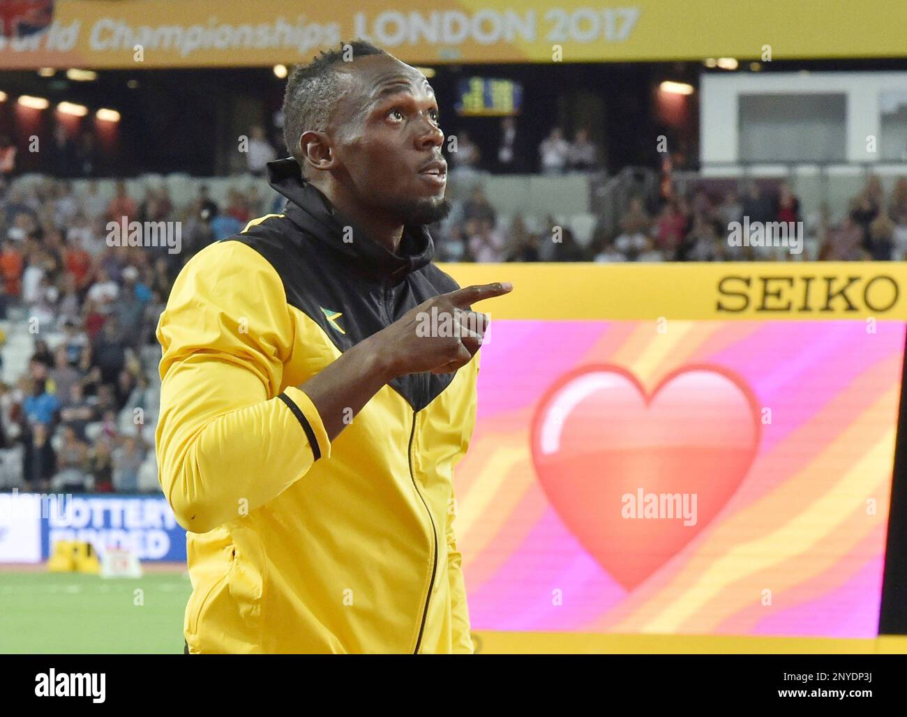 Jamaica's Usain Bolt falls down on the track during a retirement ...