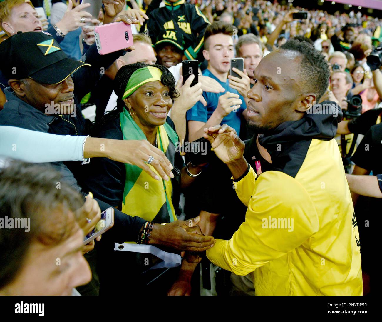 Jamaica's Usain Bolt gets applause from audience during a retirement ...