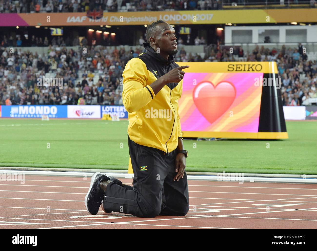 Jamaica's Usain Bolt falls down on the track during a retirement ...