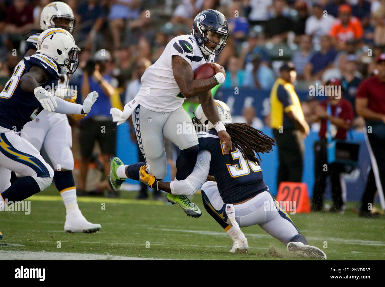 Seattle Seahawks quarterback Trevone Boykin (2), center top, is tackled ...