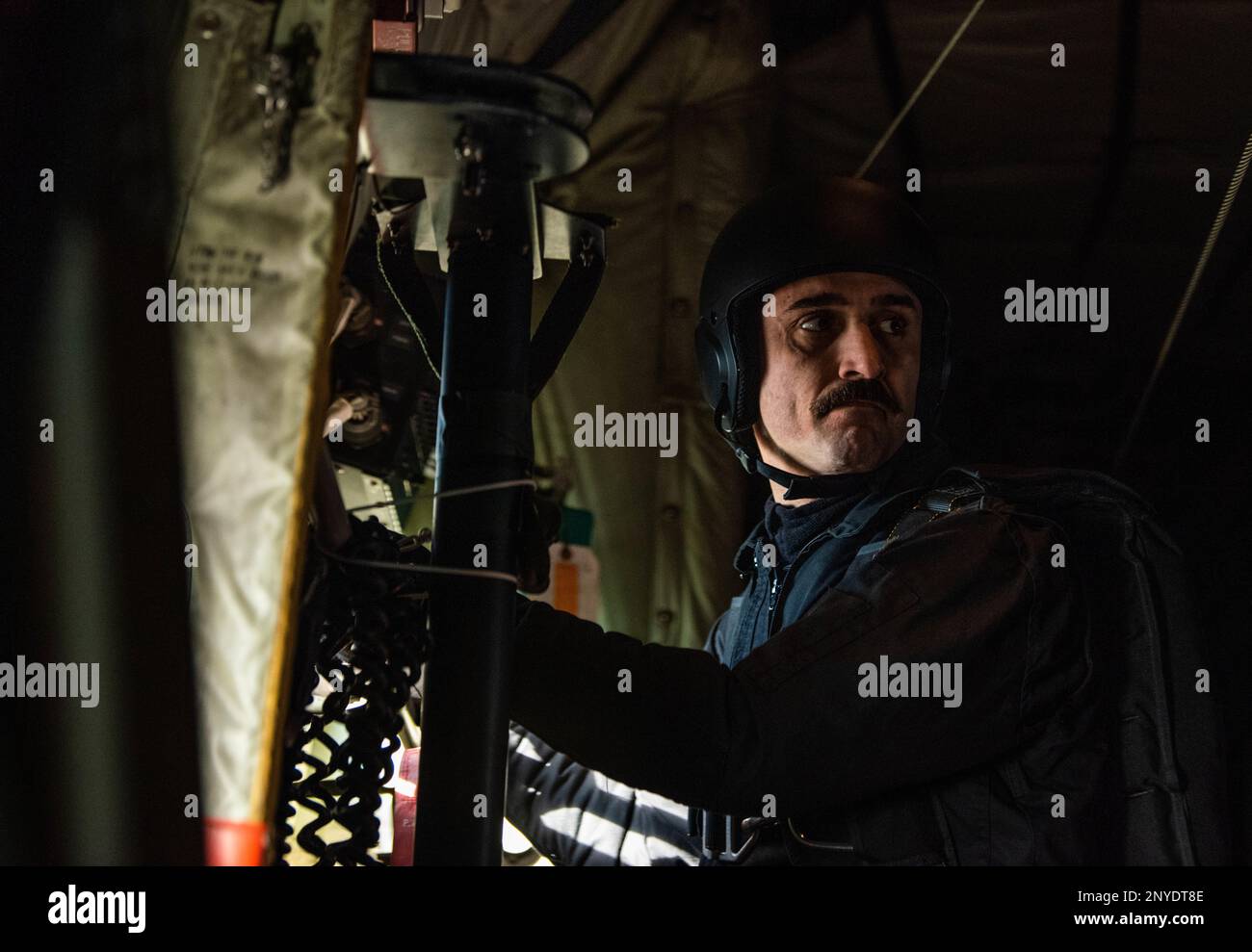 A Spanish air force jumpmaster prepares for static line jumps out of a ...