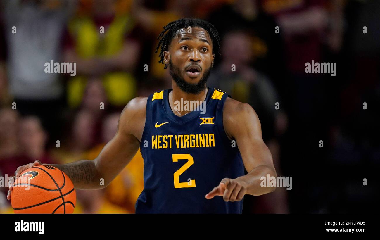West Virginia guard Kobe Johnson drives up court during an NCAA college ...