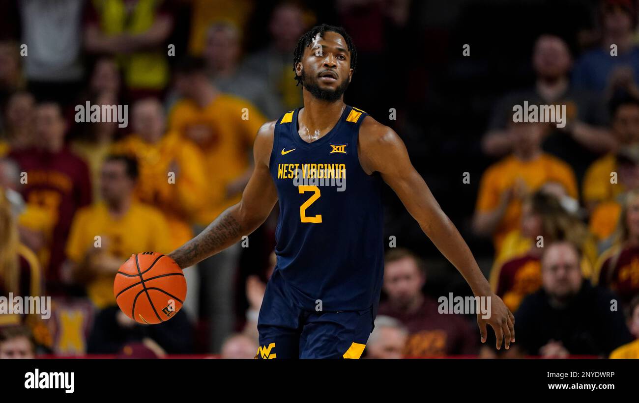 West Virginia guard Kobe Johnson drives up court during an NCAA college ...