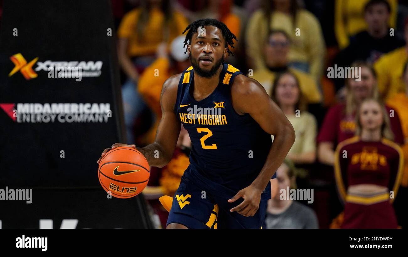 West Virginia guard Kobe Johnson drives up court during an NCAA college ...