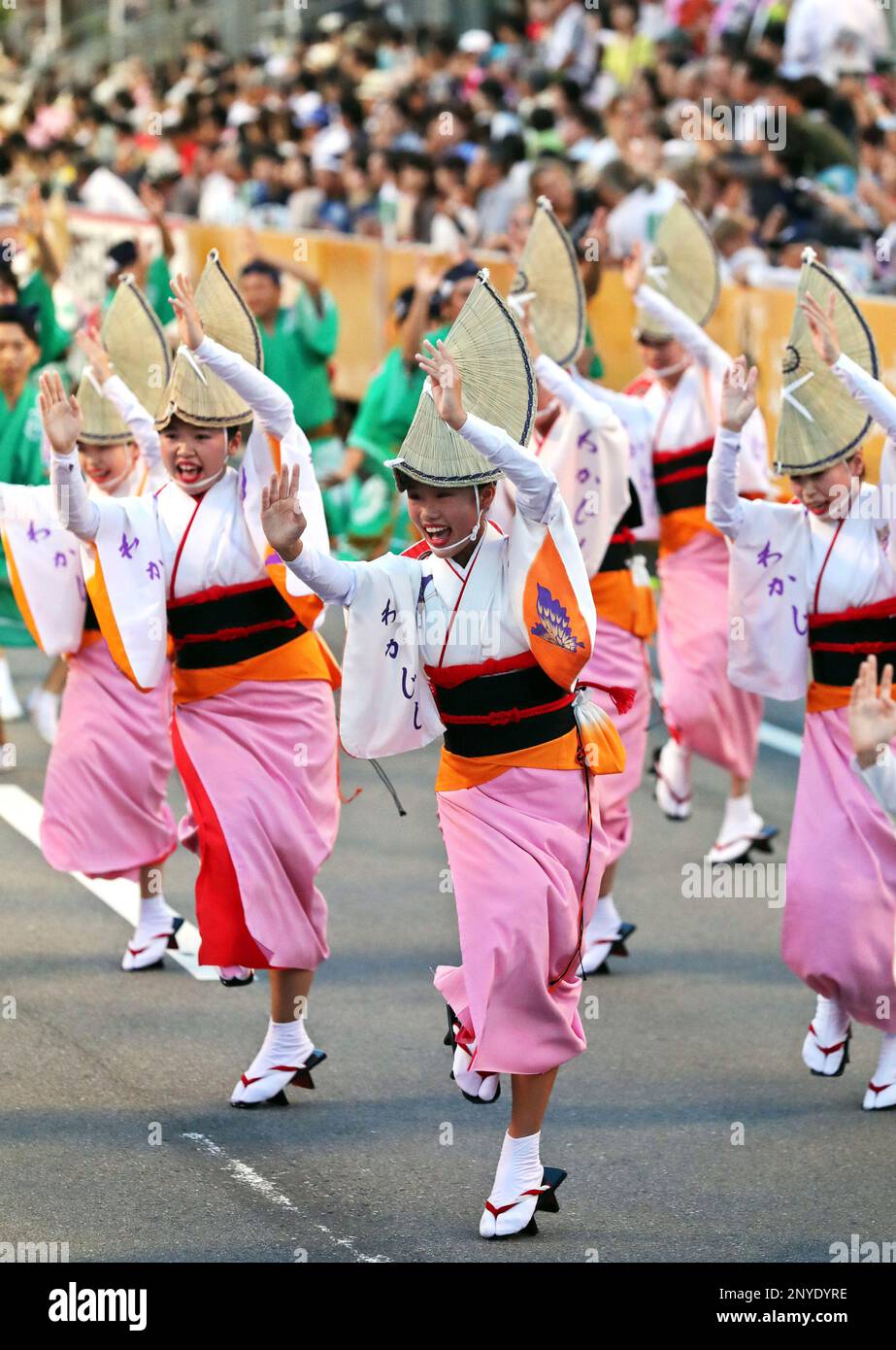 Dancers perform in tight formation during their Awa odori, the Awa ...
