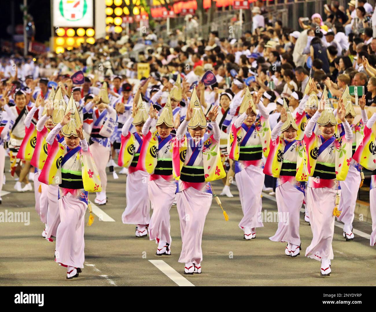 Dancers perform in tight formation during their Awa odori, the Awa ...