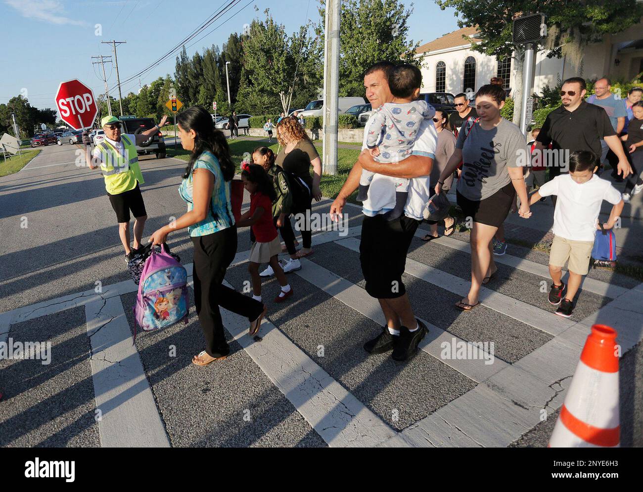 Students arrive with parents and guardians for the first day of school ...