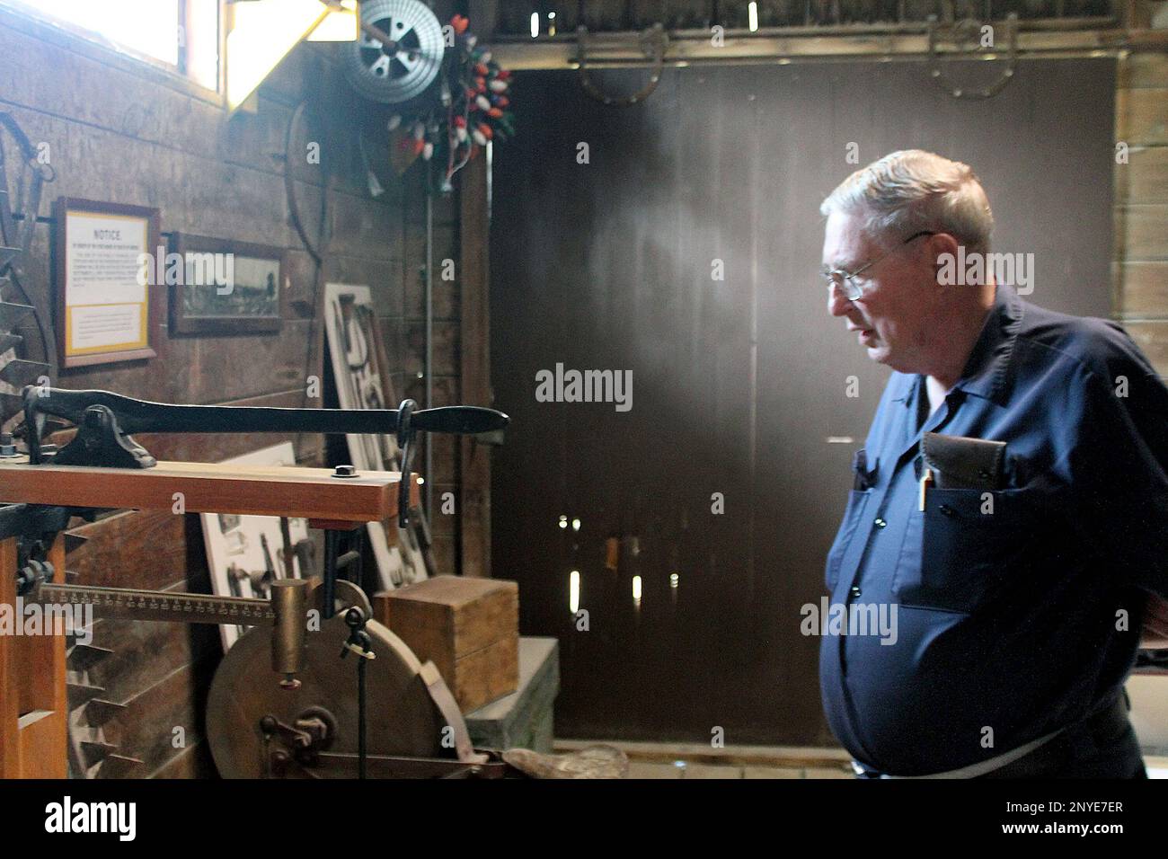 In this undated photo, Francis Davis looks at a restored railroad scale ...