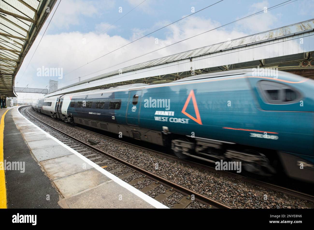 Avanti 390 Pendolino speeding through Penrith North lakes station, with ...