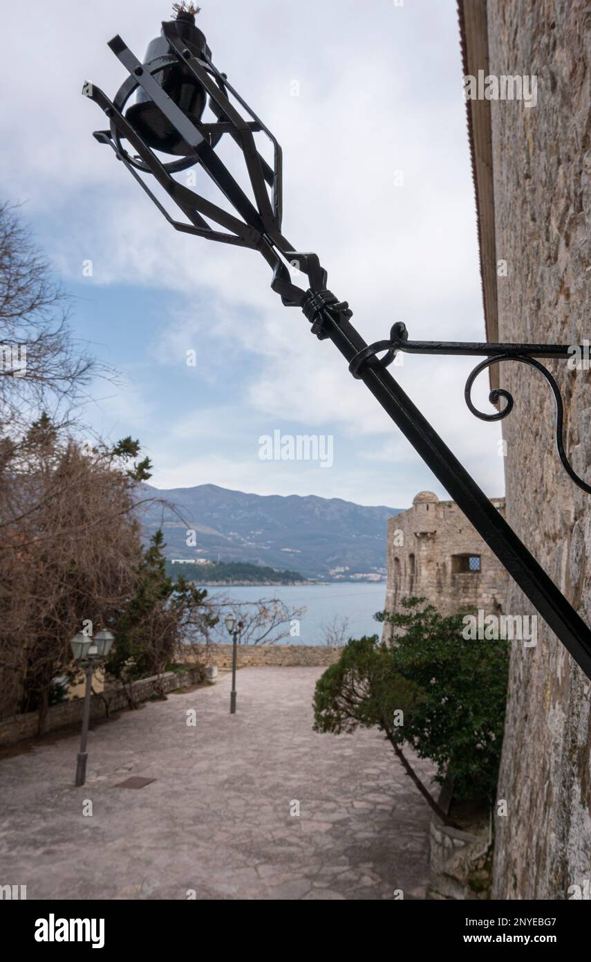 Torch on the castle wall in the old town of Budva, Montenegro Stock ...