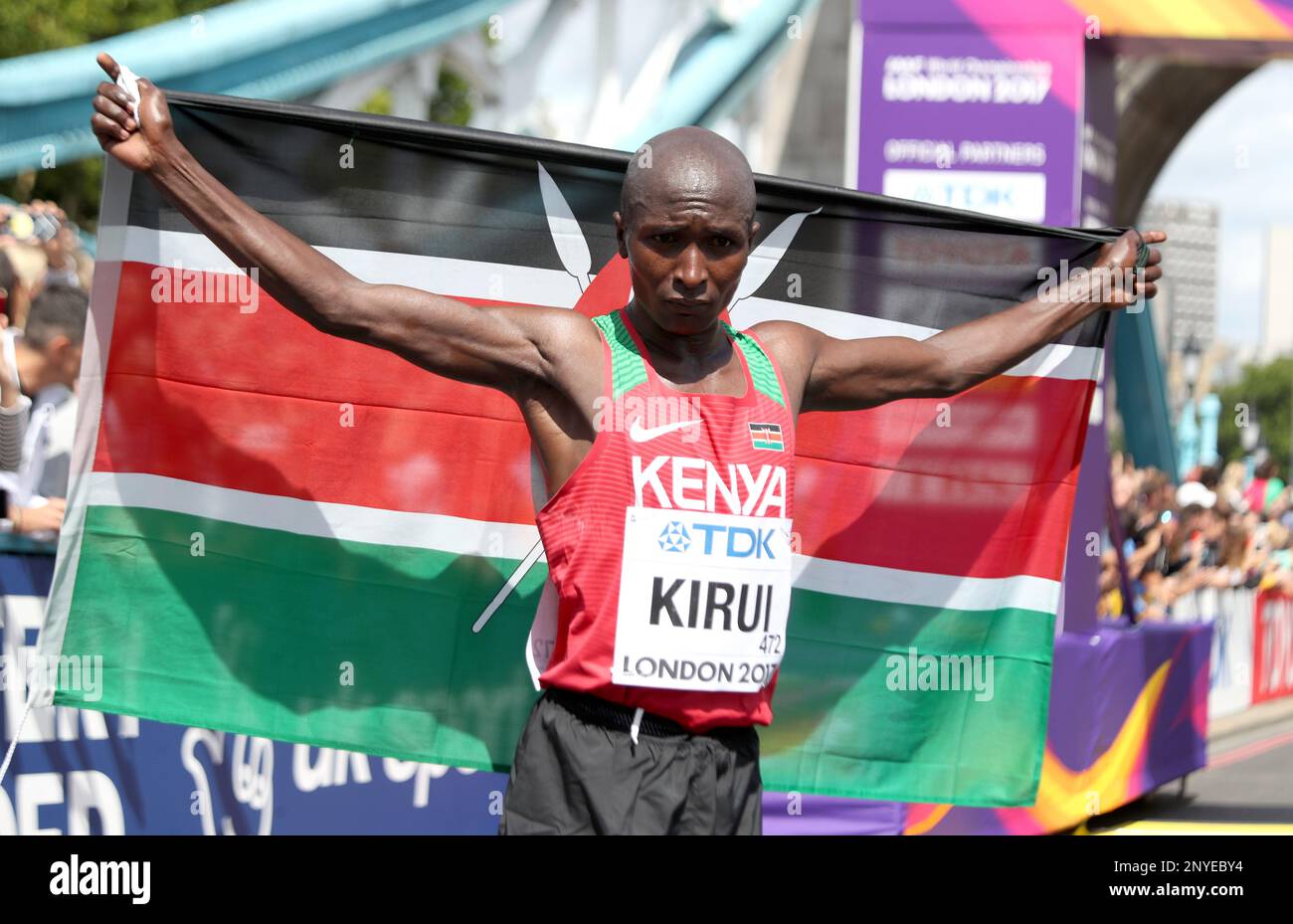Geoffrey Kirui (KEN) poses with Kenyan flag after winning the marathon in 2:08:27 in the IAAF ...