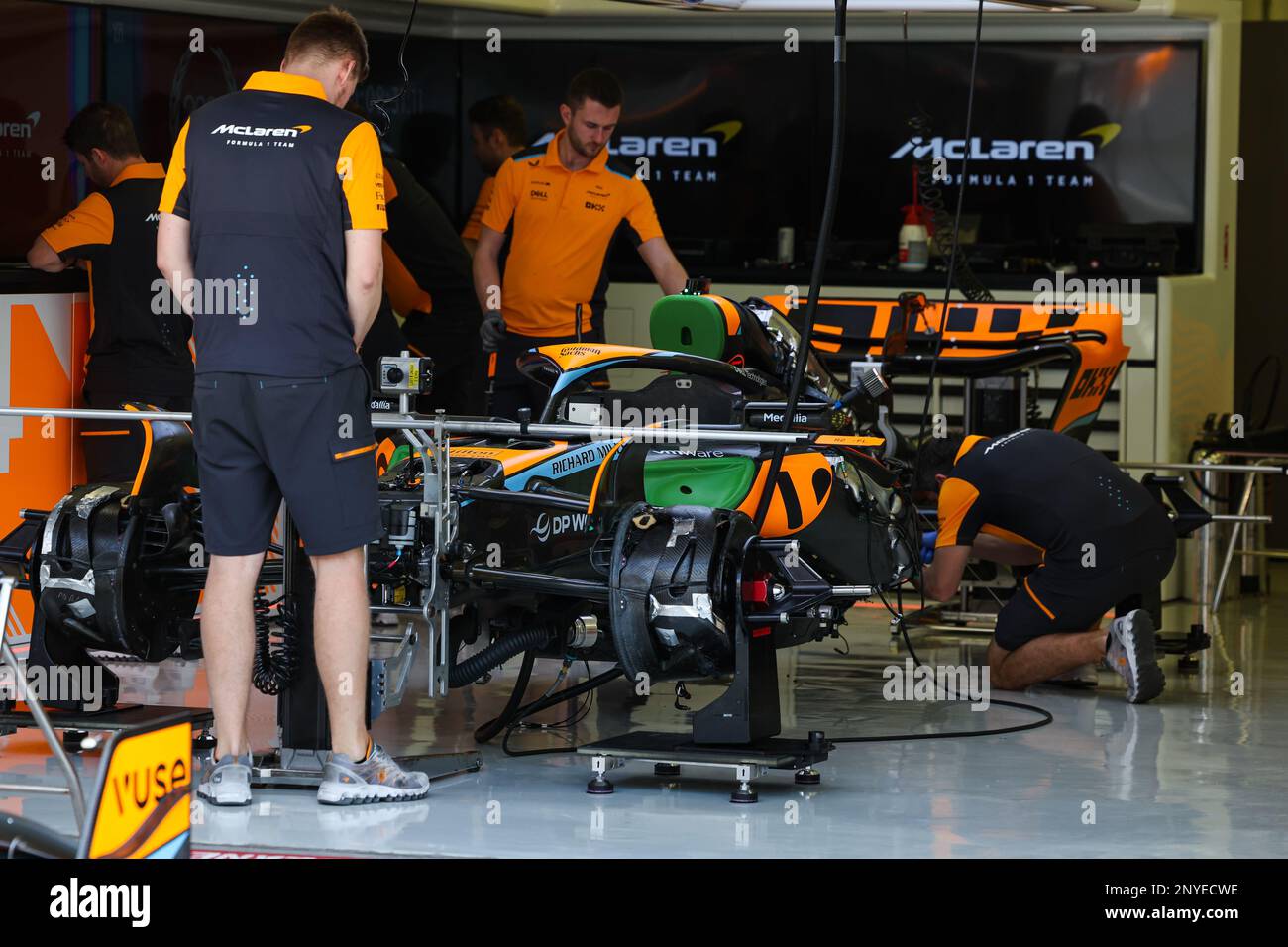 McLaren F1 Team MCL60, mechanics working on the car in the garage, box ...
